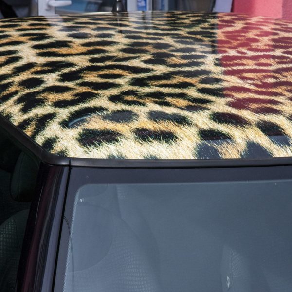 Mini Cooper branded with a leopard print | Car wrapping | Outdoor ads