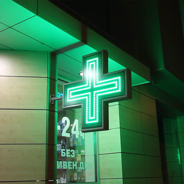Double-sided LED cross for Art Pharma | Composite panel signs