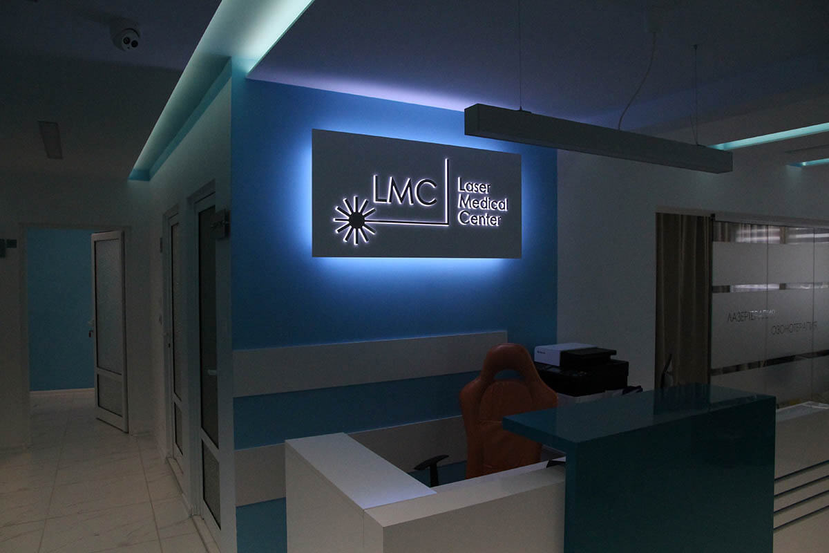 Illuminated sign with embedded letters with ambient lightning for LMC